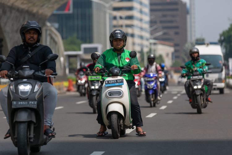 Indonesian ride-hailing drivers protest low pay, merger fears